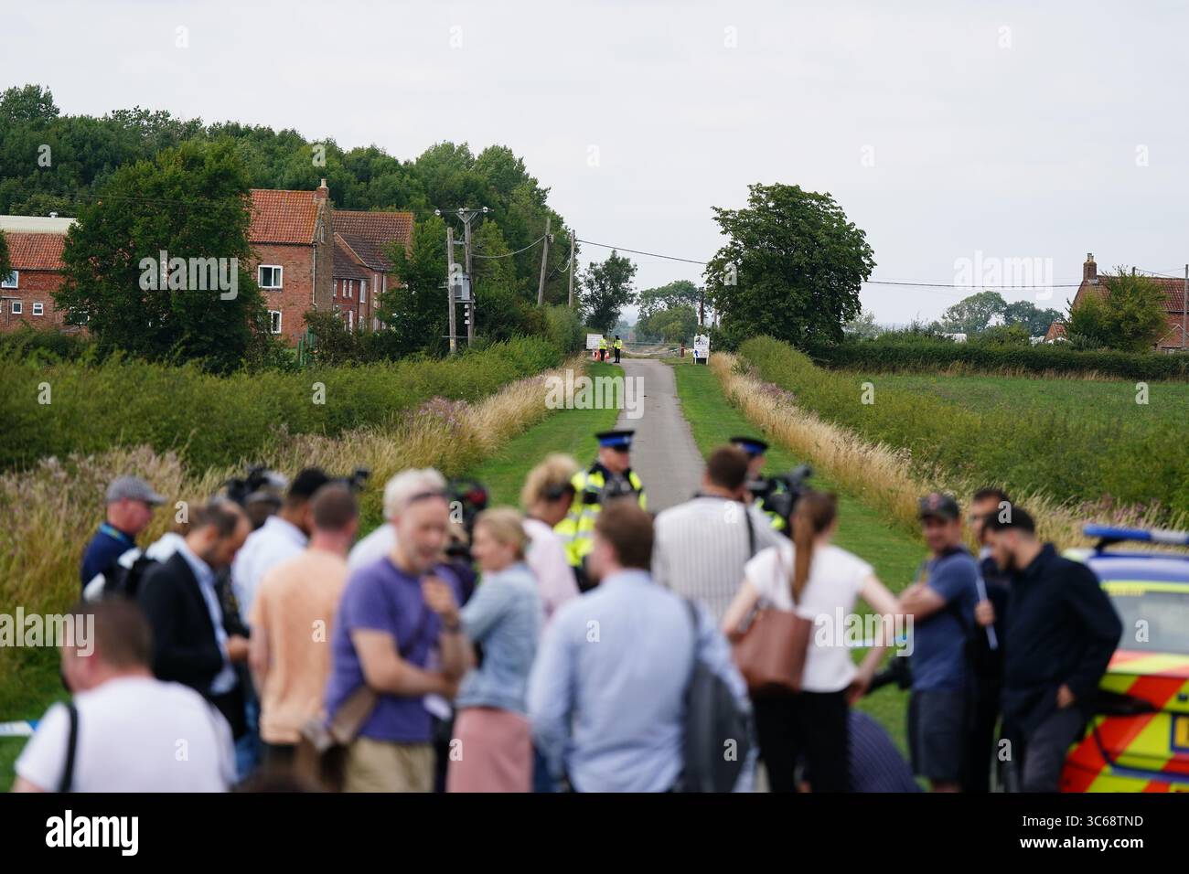 Police officers at the scene in Stathern, Leicestershire, after a 76 ...