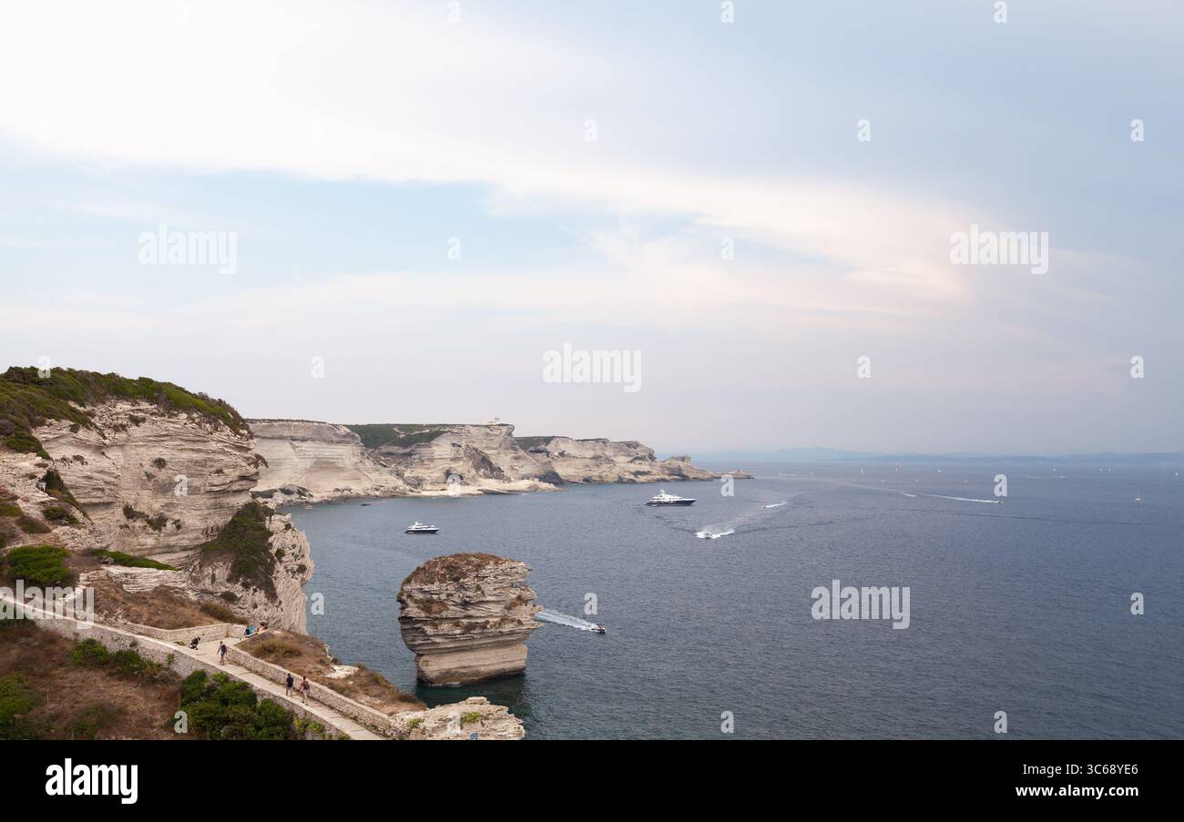A breathtaking coastal scene featuring high cliffs. The serene ...