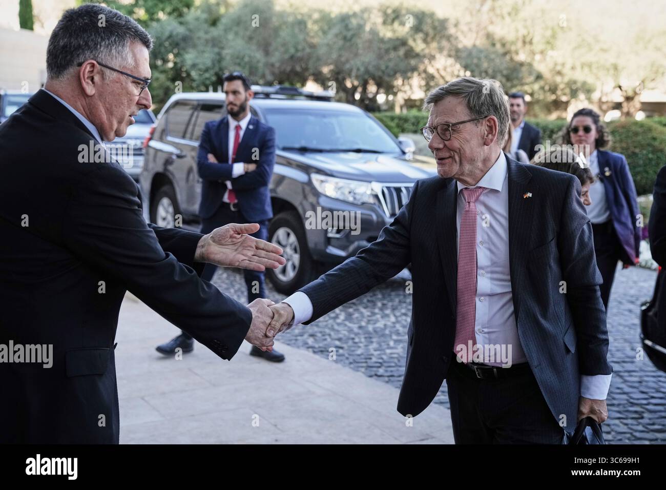 Israel's Foreign Minister Gideon Sa'ar, left, welcomes his German ...