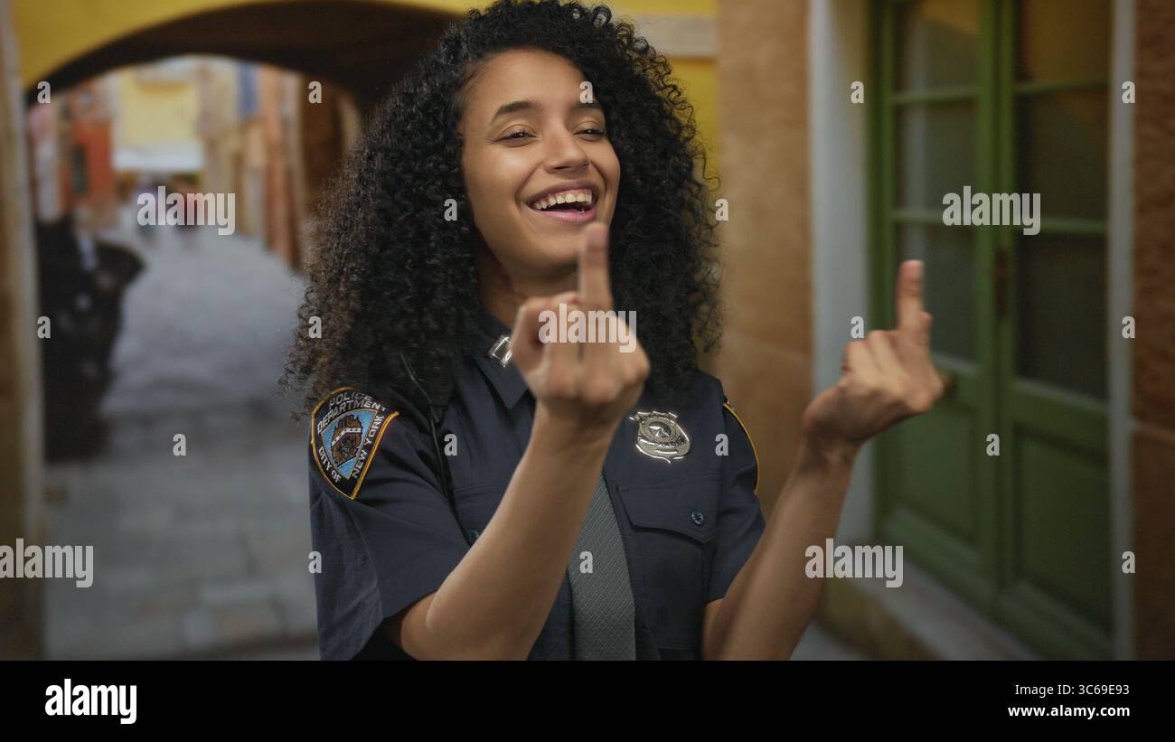 Young hispanic police officer woman in navy uniform smiling shows ...