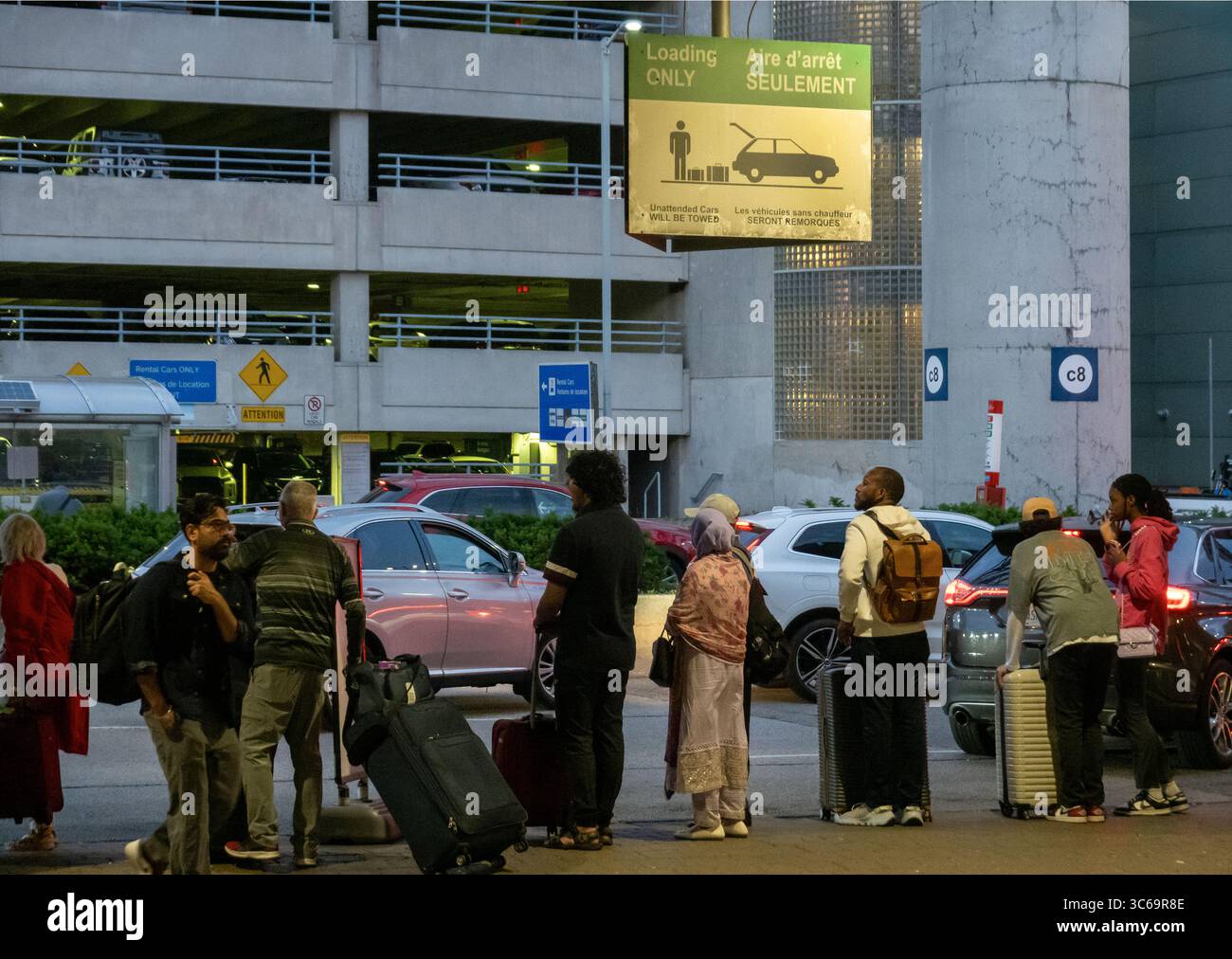 Passenger passengers waiting taxi cab exit line queue uber cars hi-res ...