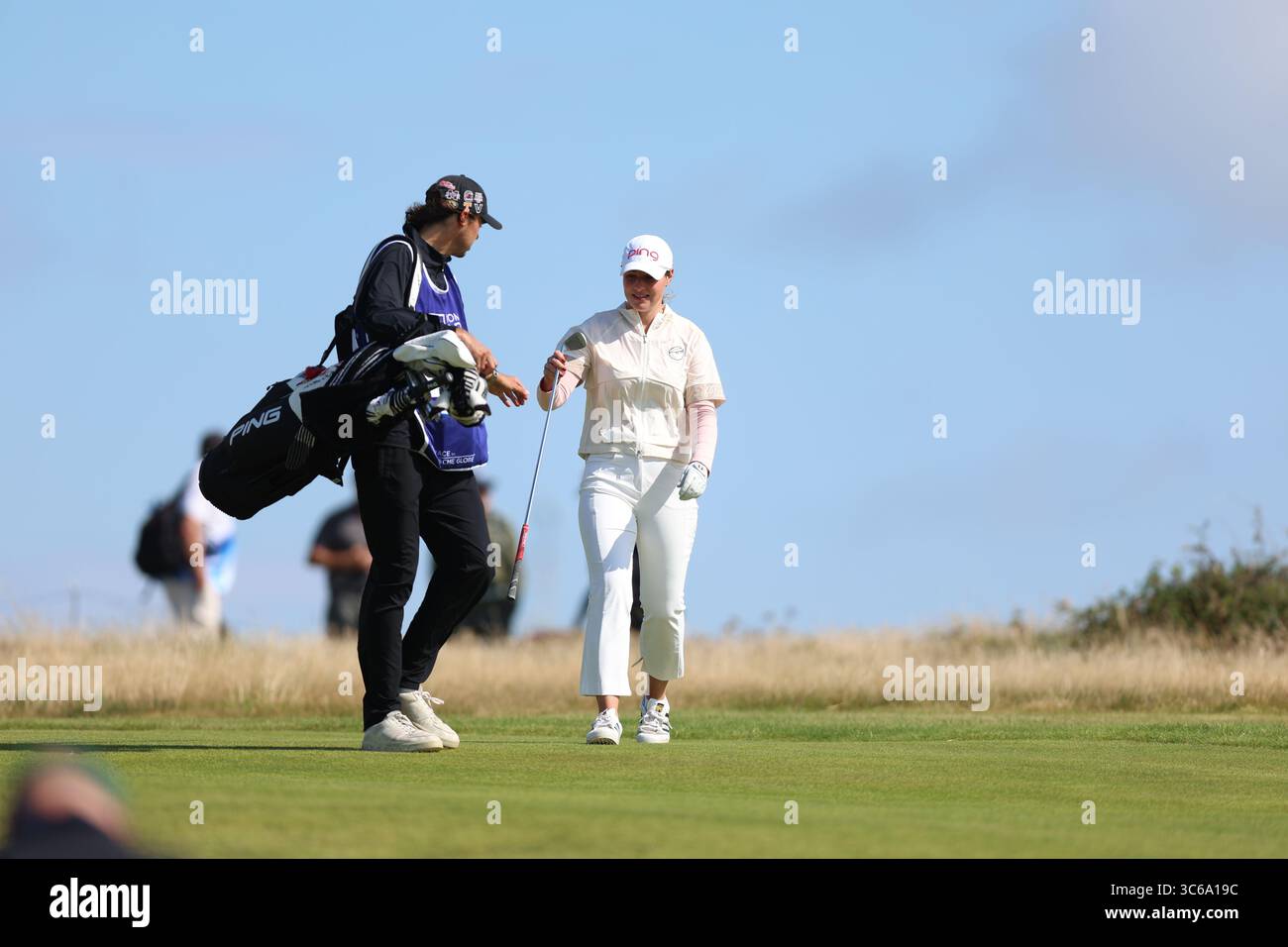 Wales's Darcey Harry with her partner and caddie, Danish golfer Jacob ...