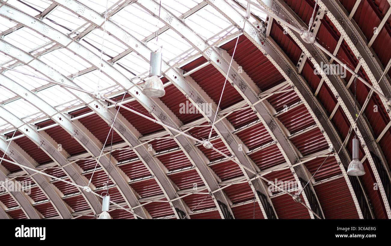Vintage metal roof structure of old London train station, architectural ...
