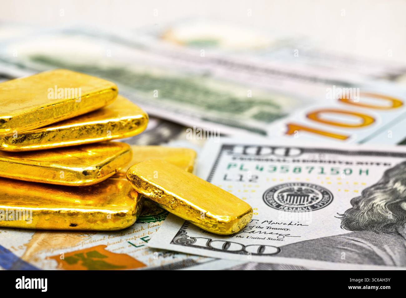 Paper us 100 dollar bill with gold bars, concept of investment and ...