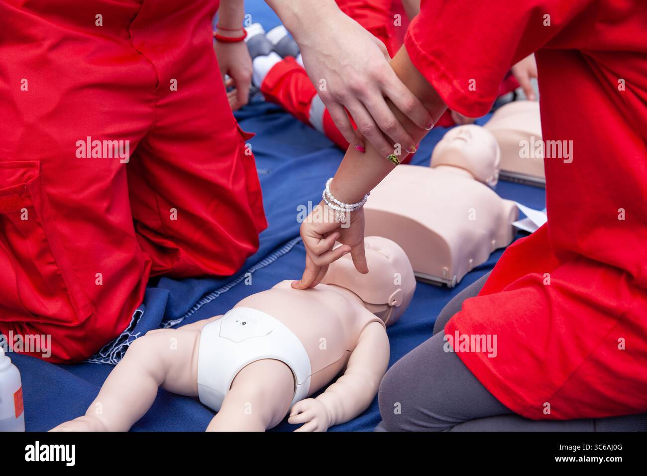 Medical training session for infant CPR with participants learning ...