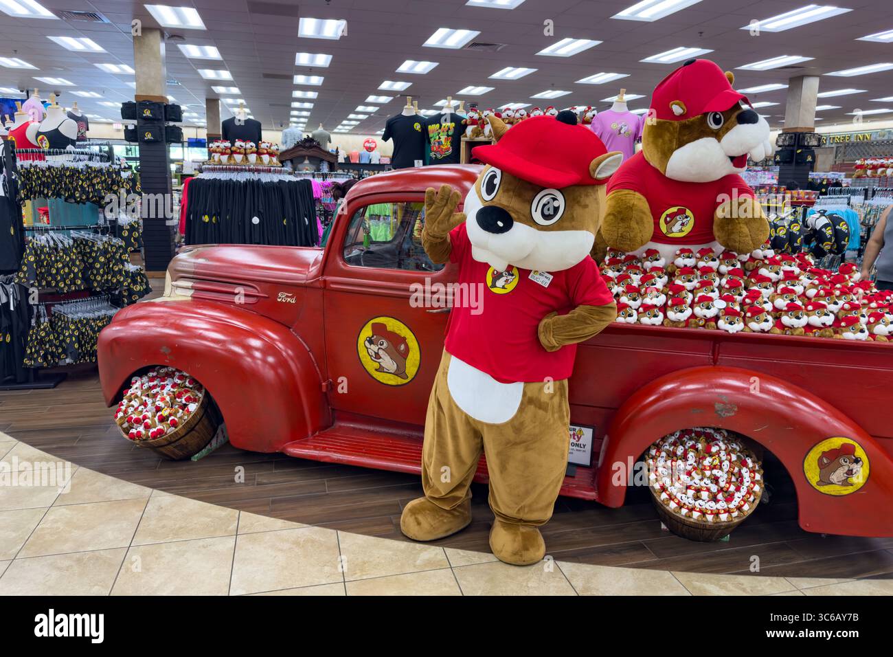 A Buc-ee the Beaver mascot poses for pictures in a Buc-ee's travel ...