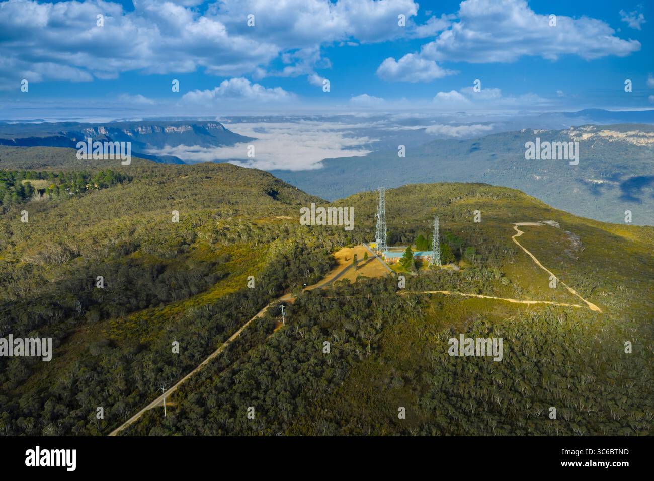 Drone aerial photograph of large communication towers on the ridge line ...
