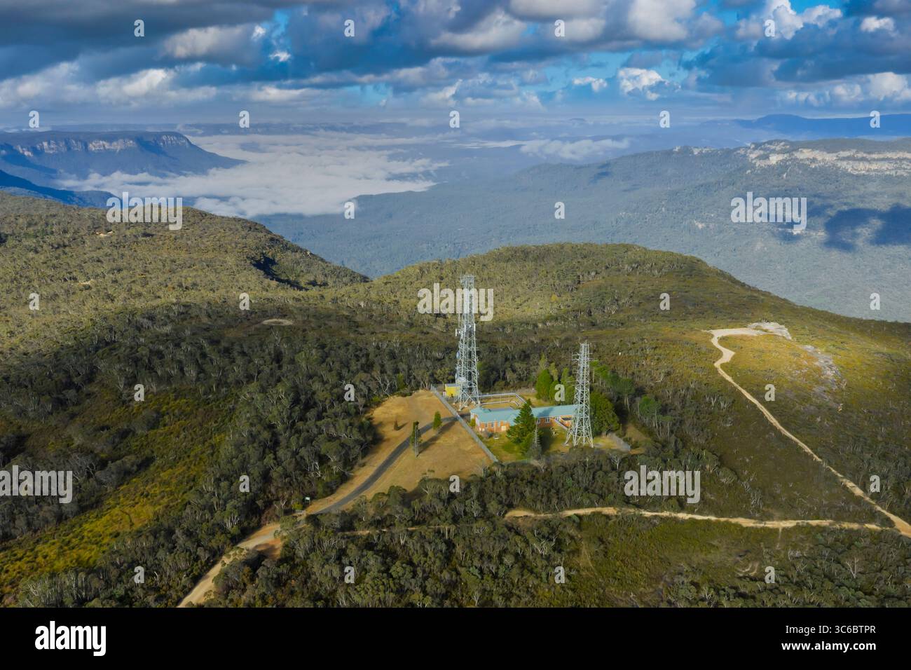 Drone aerial photograph of large communication towers on the ridge line ...