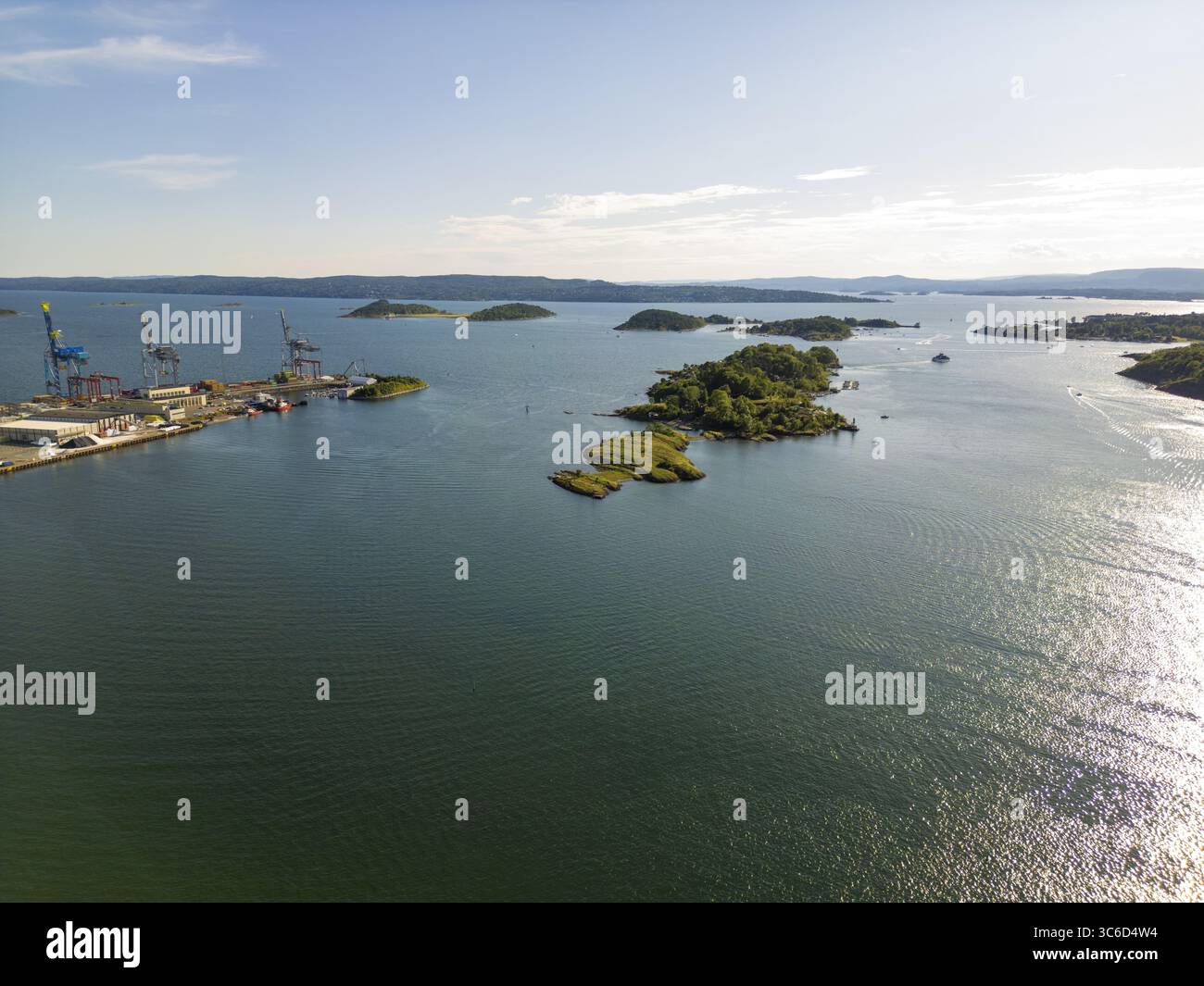 Aerial view of glistening waters surrounding verdant islands and the ...