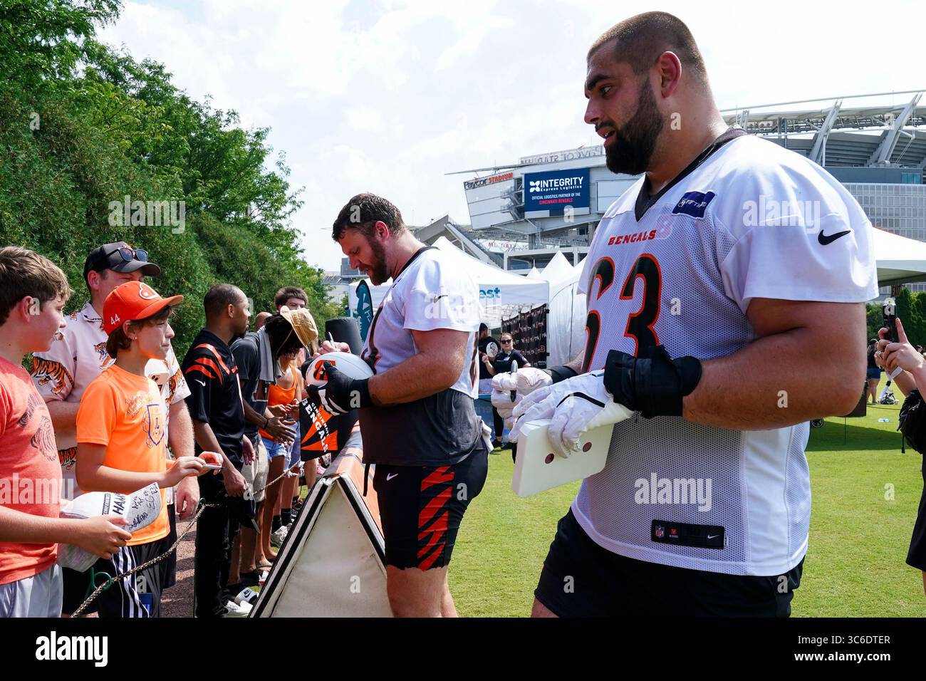 Cincinnati Bengals guard Dylan Fairchild (63) signs autographs during ...