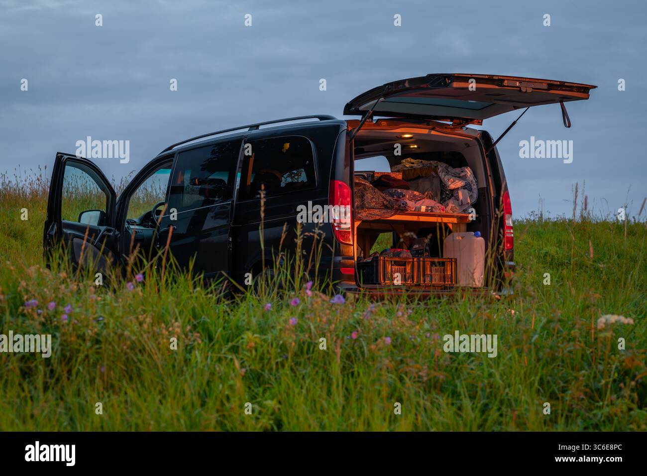 Van car on parking lot in summer fresh cloudy evening in Mala Lhota CZ ...