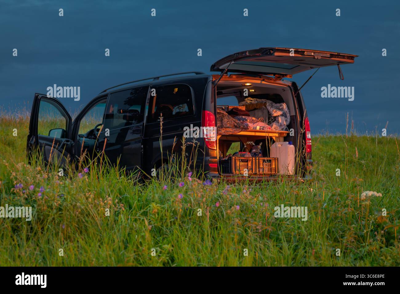 Van car on parking lot in summer fresh cloudy evening in Mala Lhota CZ ...