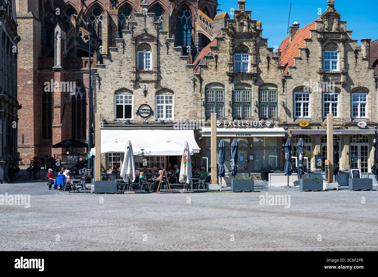 Local tourists at the old market square of Veurne, West Flemish Region ...