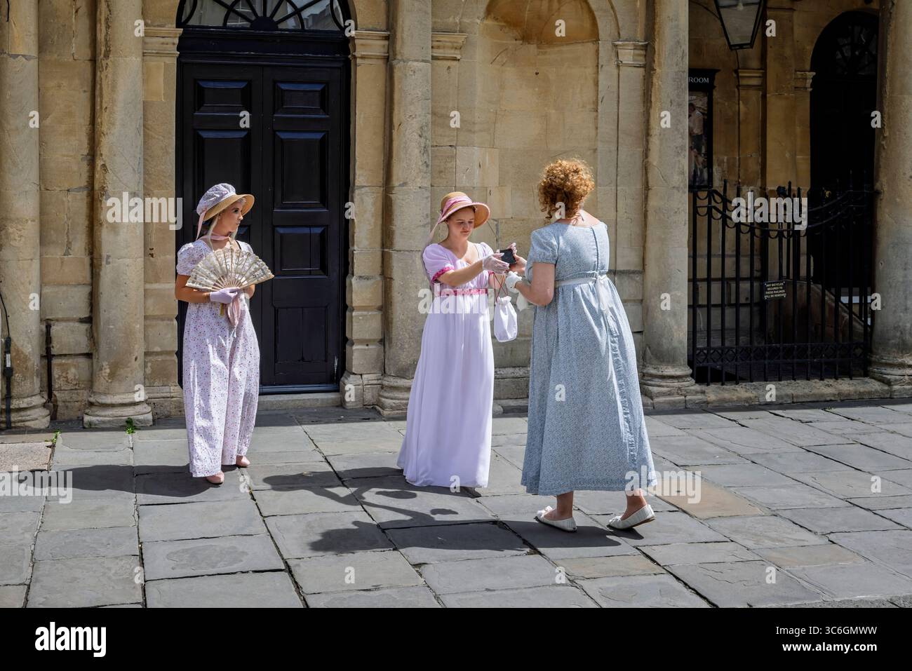 Group of young ladies dressed in Jane Austen period costumes near the ...