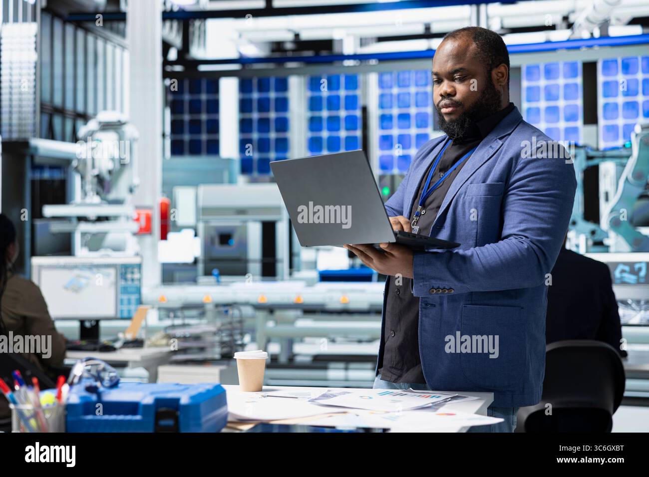Operations employee checking performance hi-res stock photography and ...
