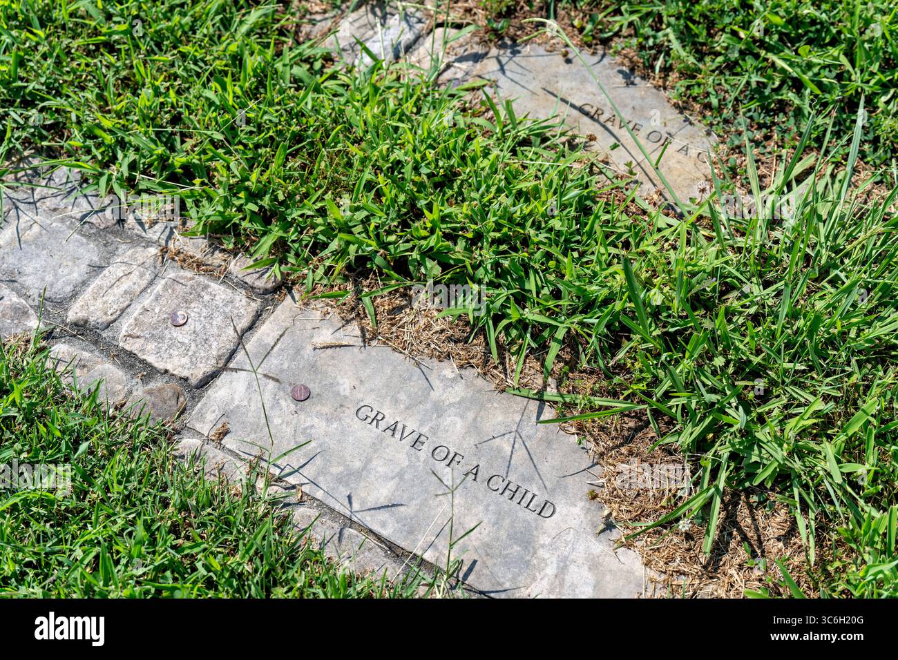 ALEXANDRIA, Virginia — Grave markers inscribed with "Grave of a Child ...