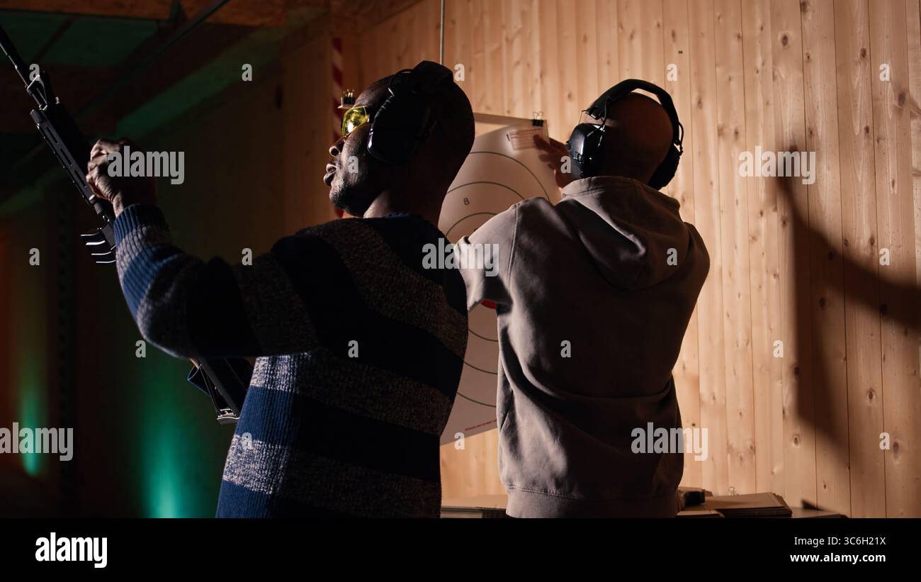 Man holds rifle, enjoying recreational shooting experience in firing ...