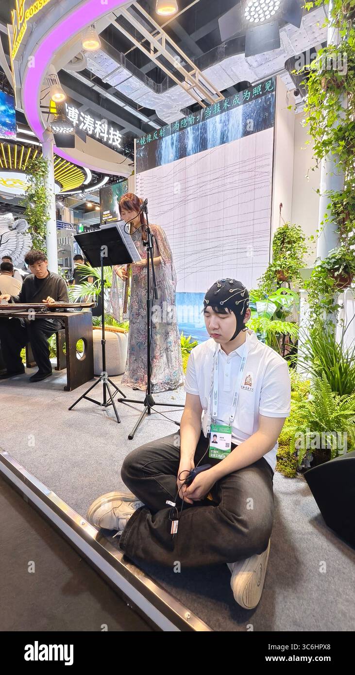 A participant wore professional devices such as electroencephalogram ...