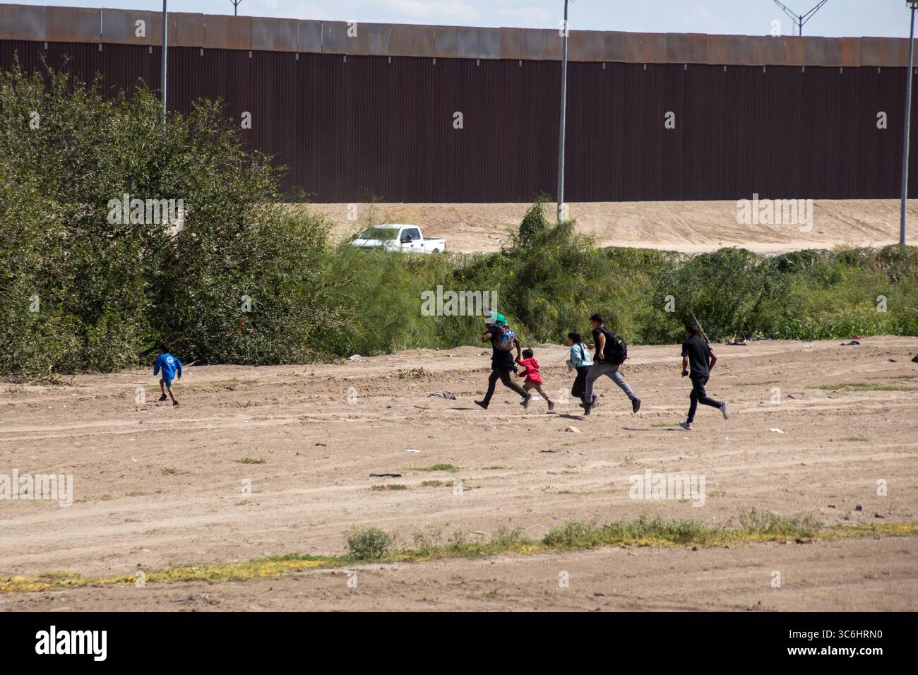 Civilians, including children, flee across a harsh terrain near Ciudad ...