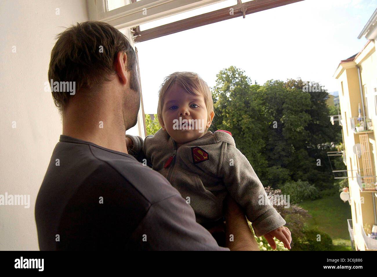 a father taking care of his infant child, paternity leave father with ...