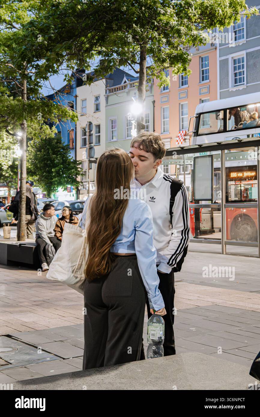 July 25, 2025 Cork, Ireland A couple shares a warm embrace on a bright ...