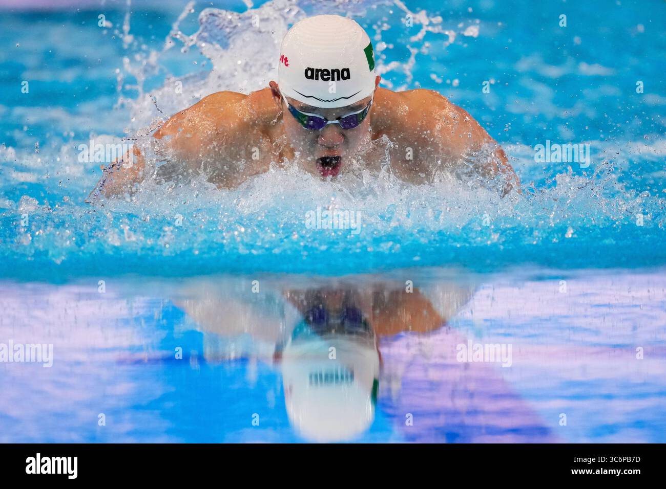 Chi Chong Lam of Macau competes in the men's 100-meter butterfly heats ...