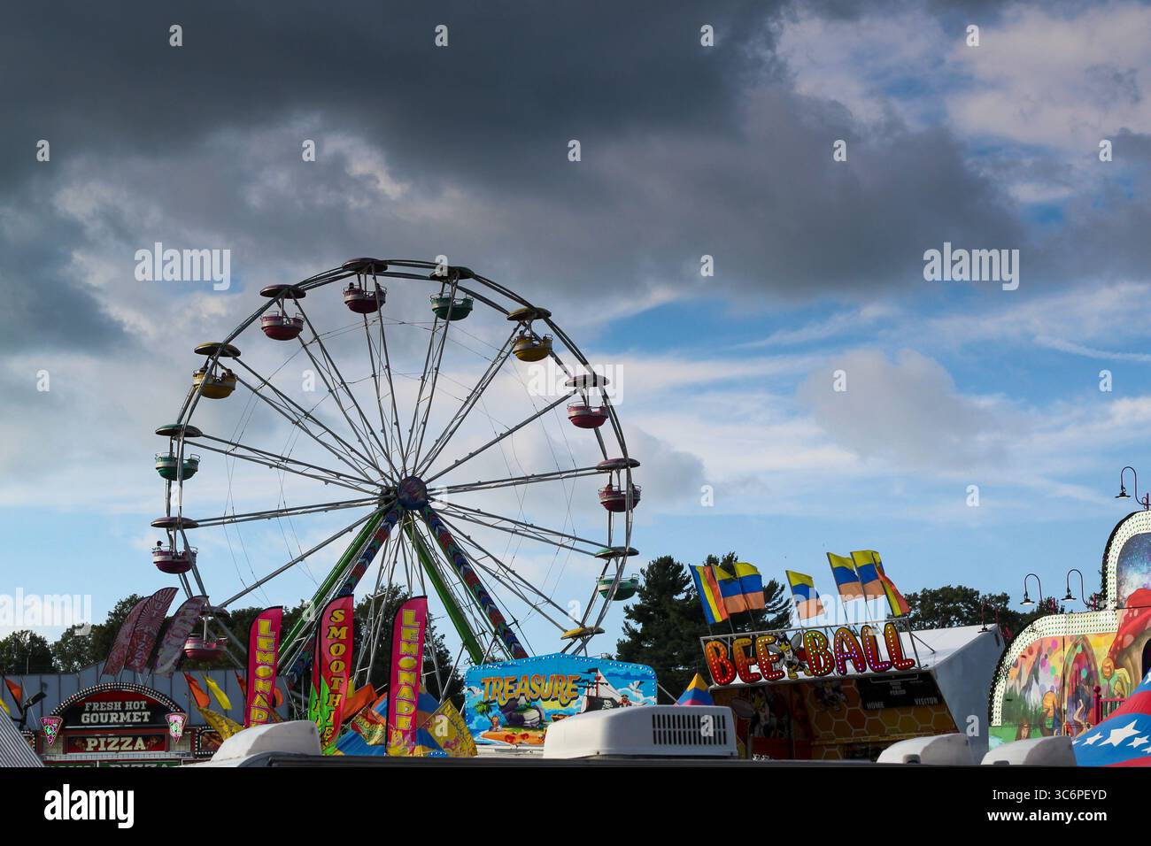 Fairground Scene Under Moody, Overcast Sky Stock Photo - Alamy