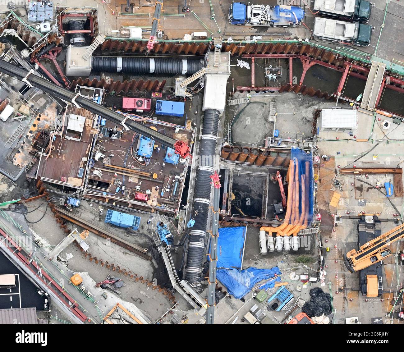 An aerial photo shows the site of a road collapse accident in Yashio ...