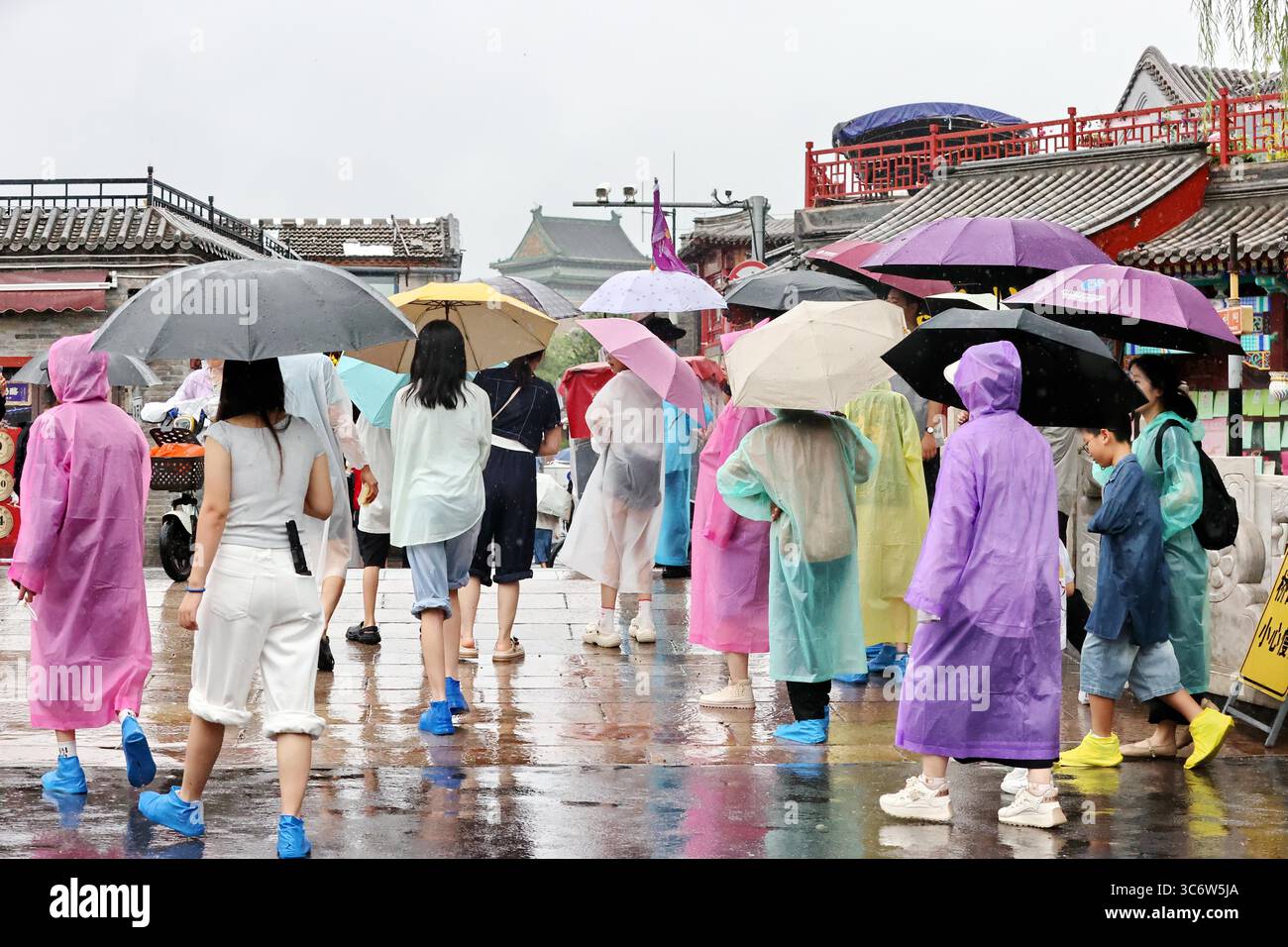 Tourists visit Shichahai scenic area in the rain in Beijing, China, 29 ...