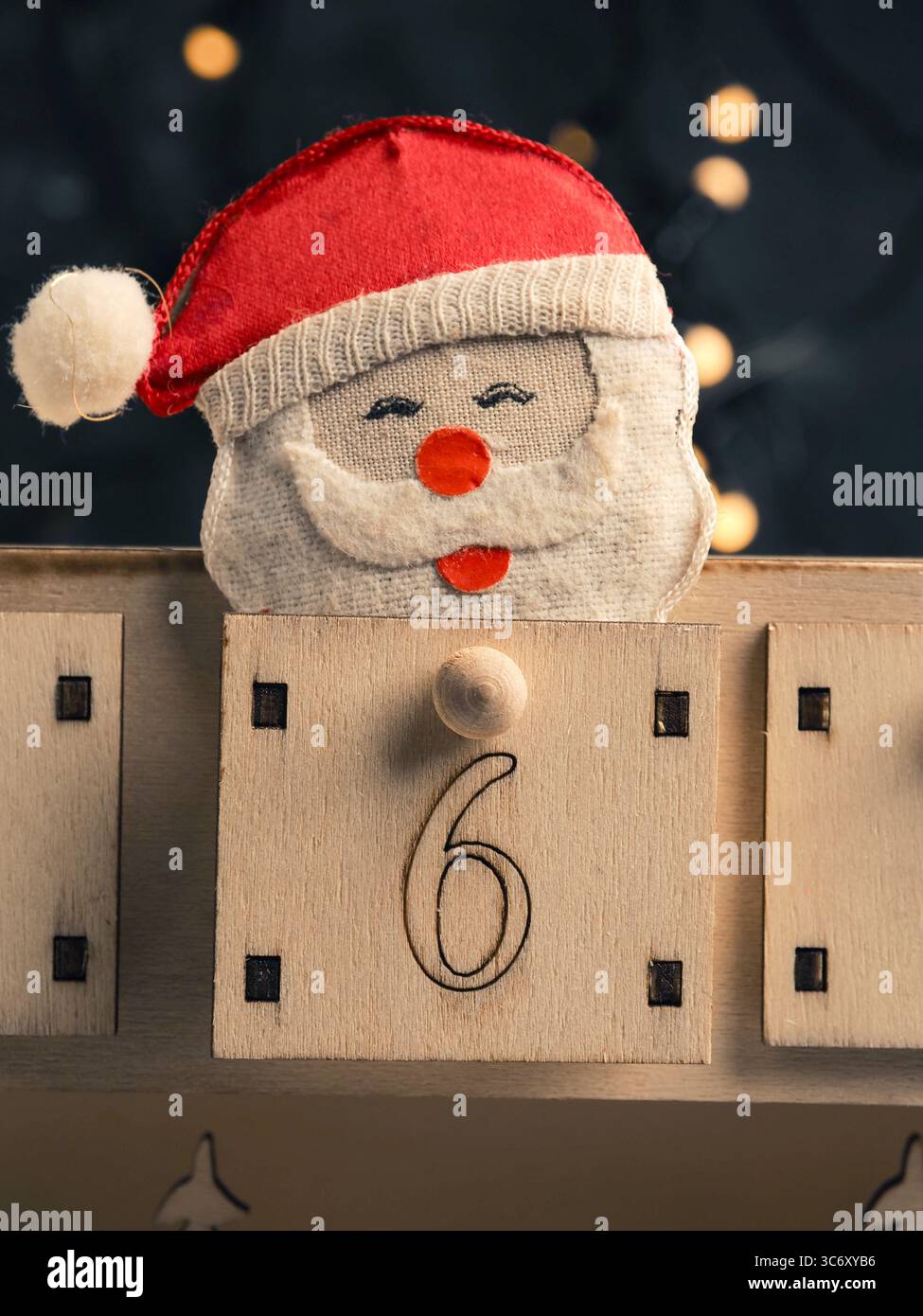 Sixth December wooden drawer number six with Santa head on blurred ...