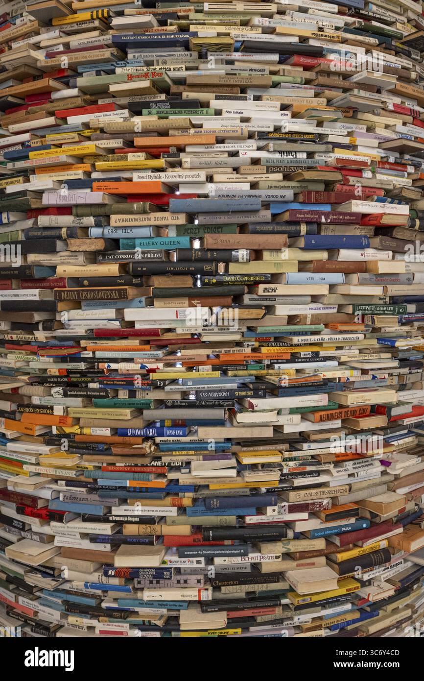 A huge tower of colourful books stacked in a spiral arrangement, Book ...