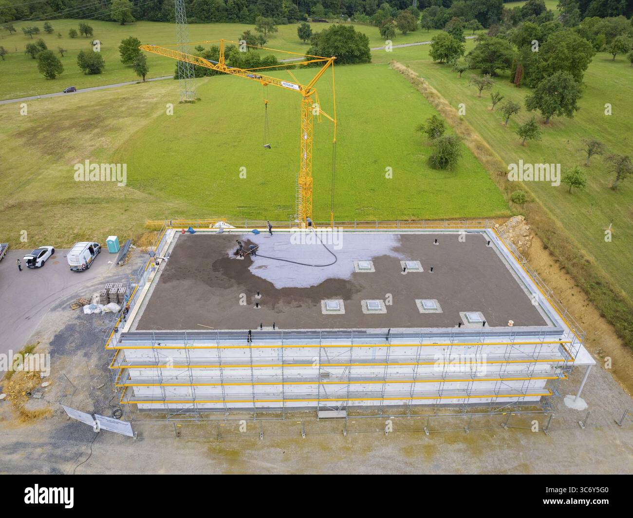 Drone shot of a construction site with crane and partially constructed ...