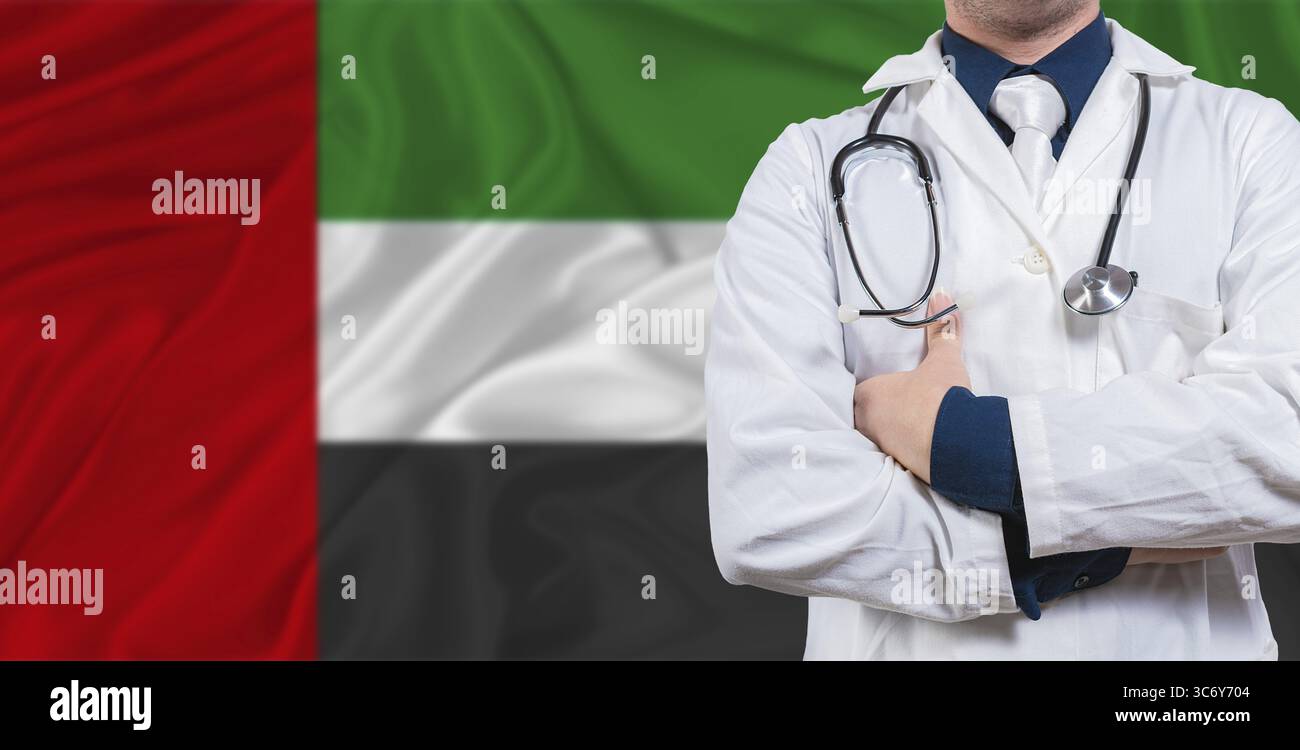 Male doctor with stethoscope on United Arab Emirates flag. Doctor ...