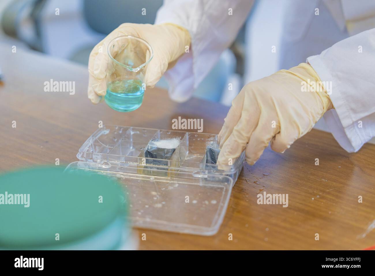 Laboratory environment beaker gloves hi-res stock photography and ...