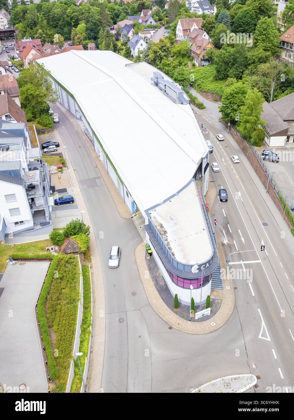 Aerial view of a modern building on a street corner in an urban ...
