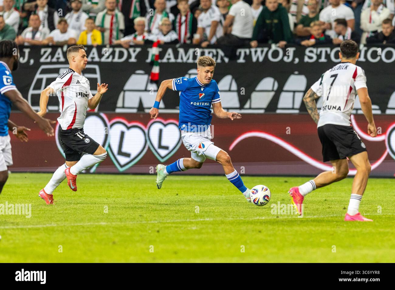 L-R Kacper Chodyna (Legia), Tomas Zlatohlavek (Banik) and Pawel Wszolek ...