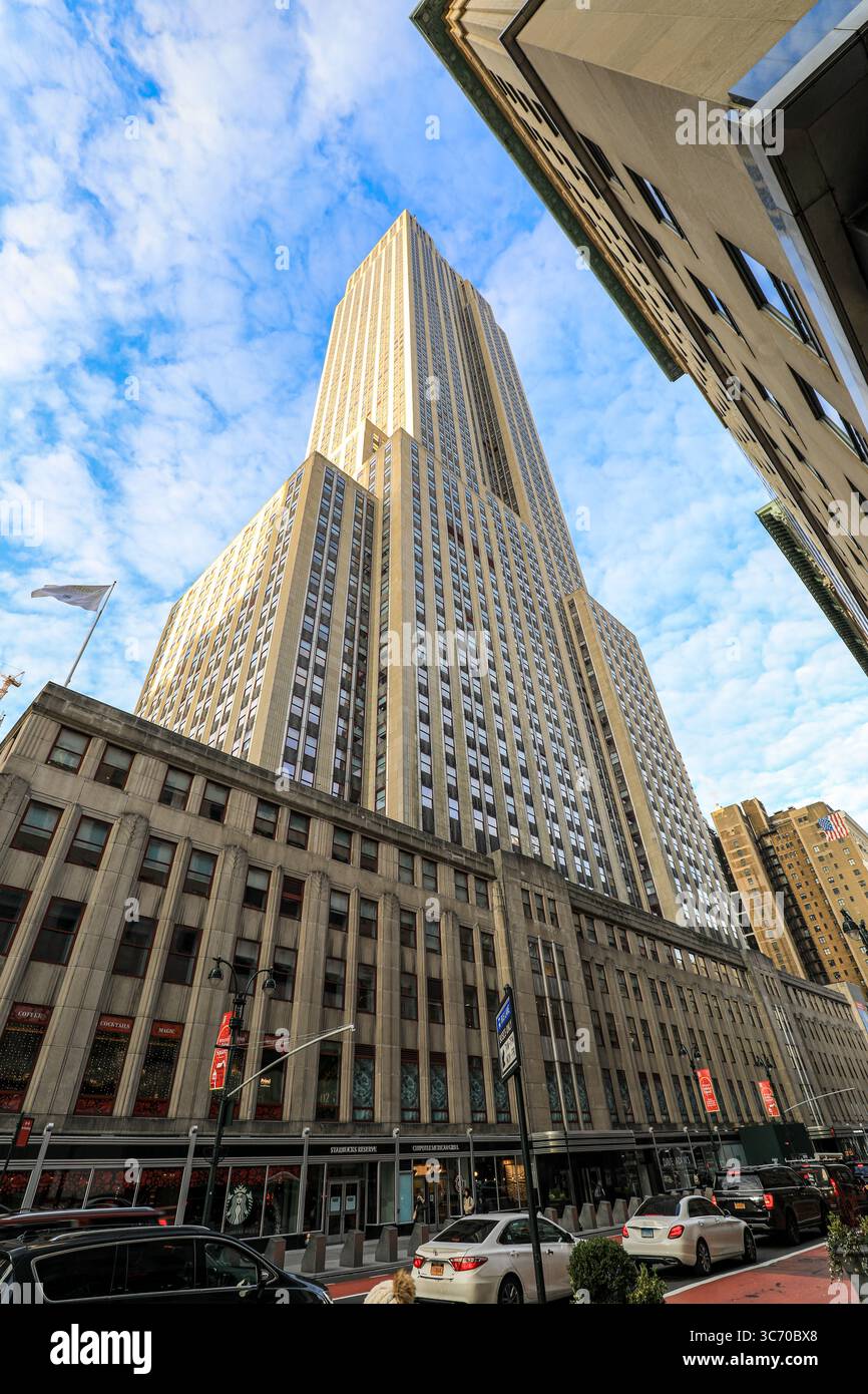 Low angle street view of The Empire State Building in Manhattan, New ...