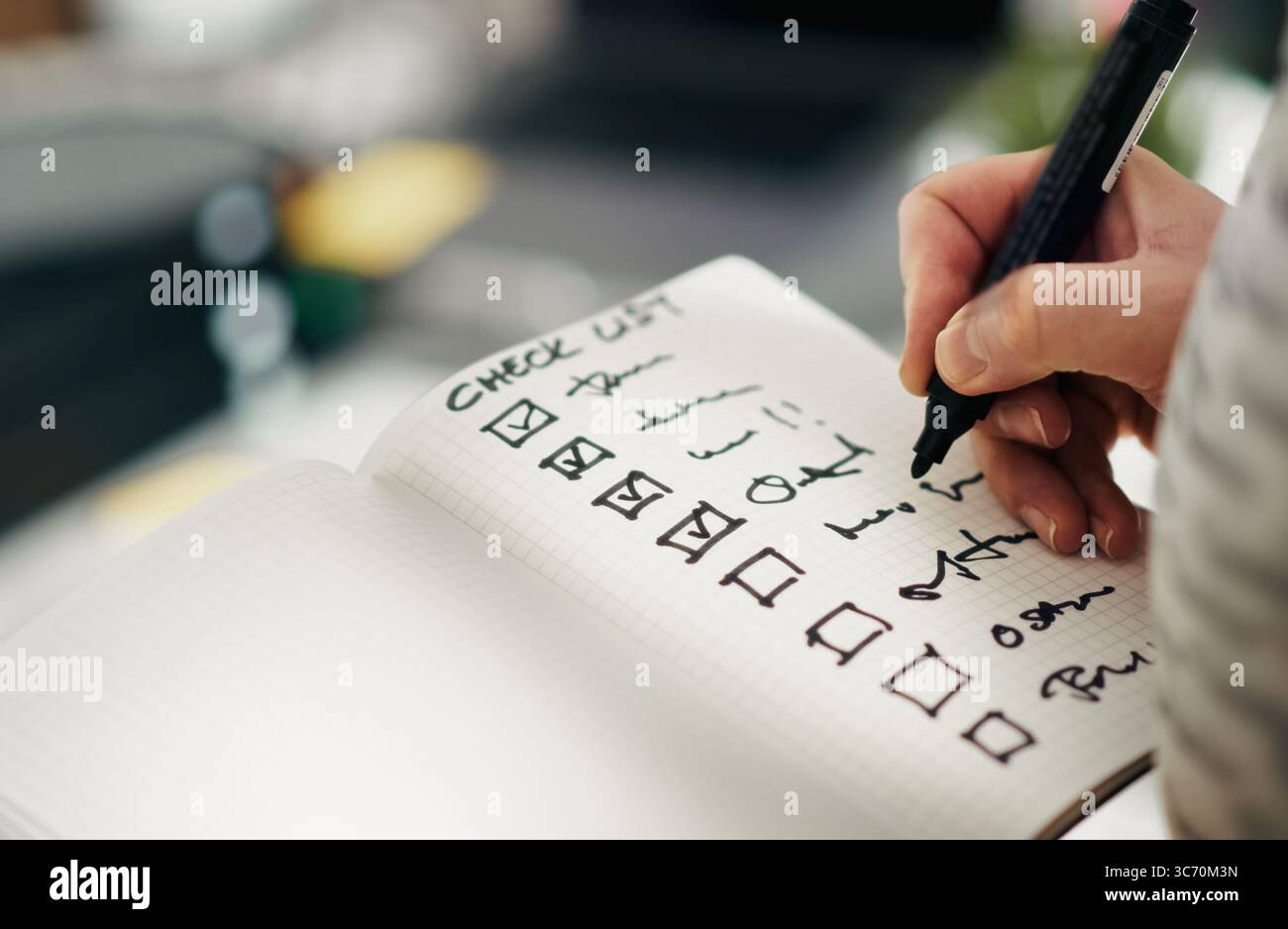 Checklist notebook task progress accuracy. Close-up hand holding pen ...