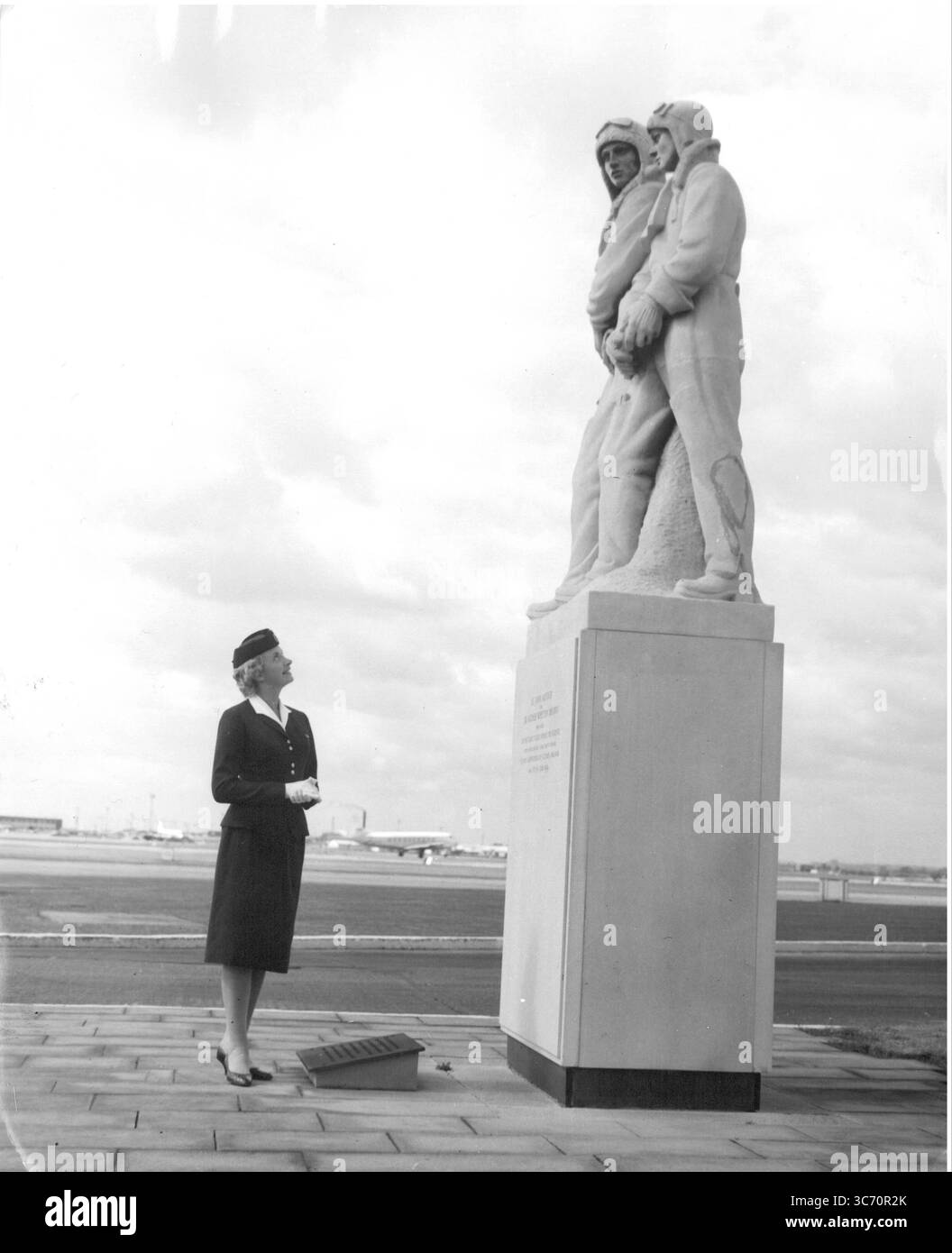 Stewardess Eve Kenny with the statue of Sir John Alcock and Sir Arthur ...