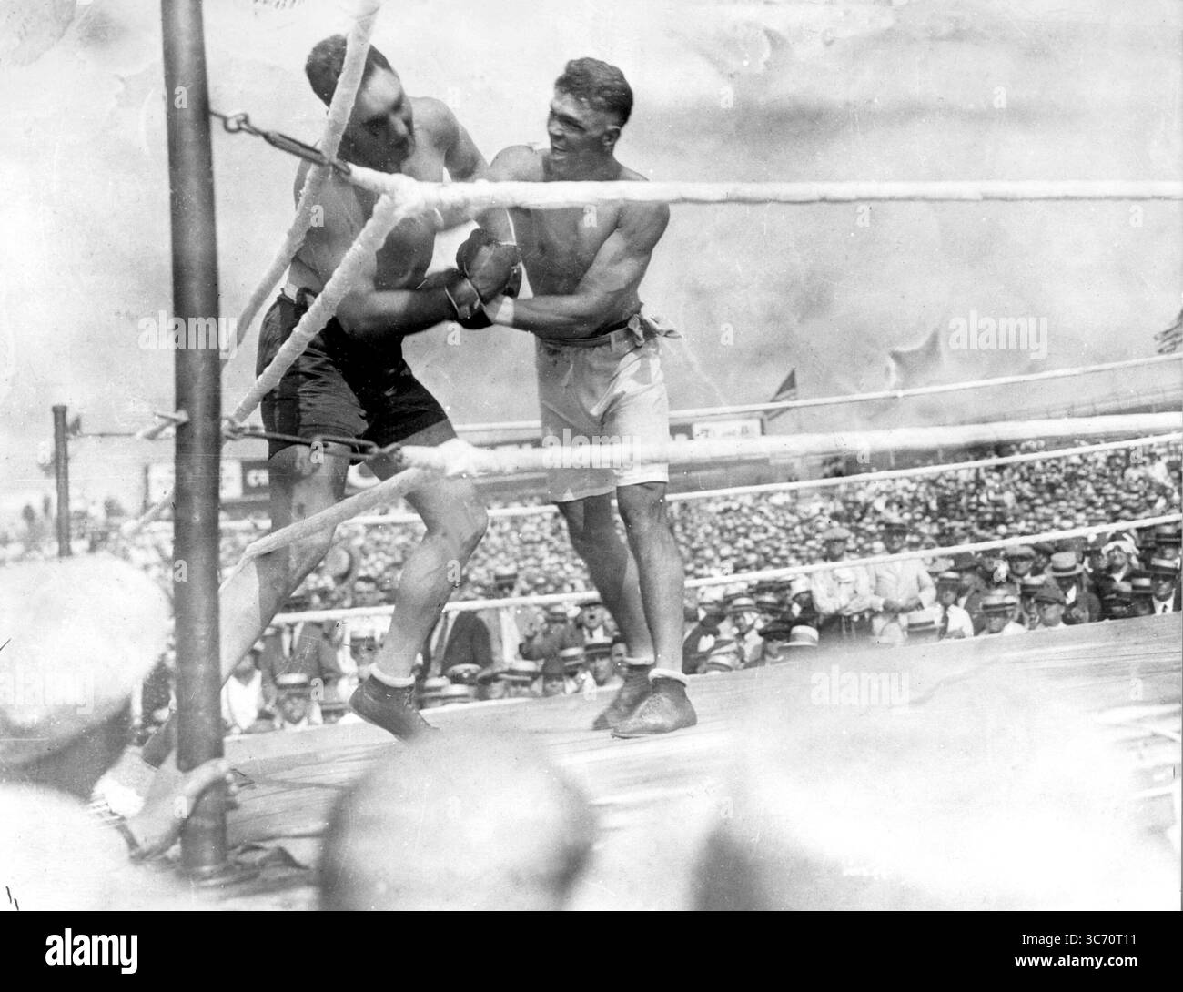 Jack Dempsey (Right) traps Jess Willard in a corner during the ...