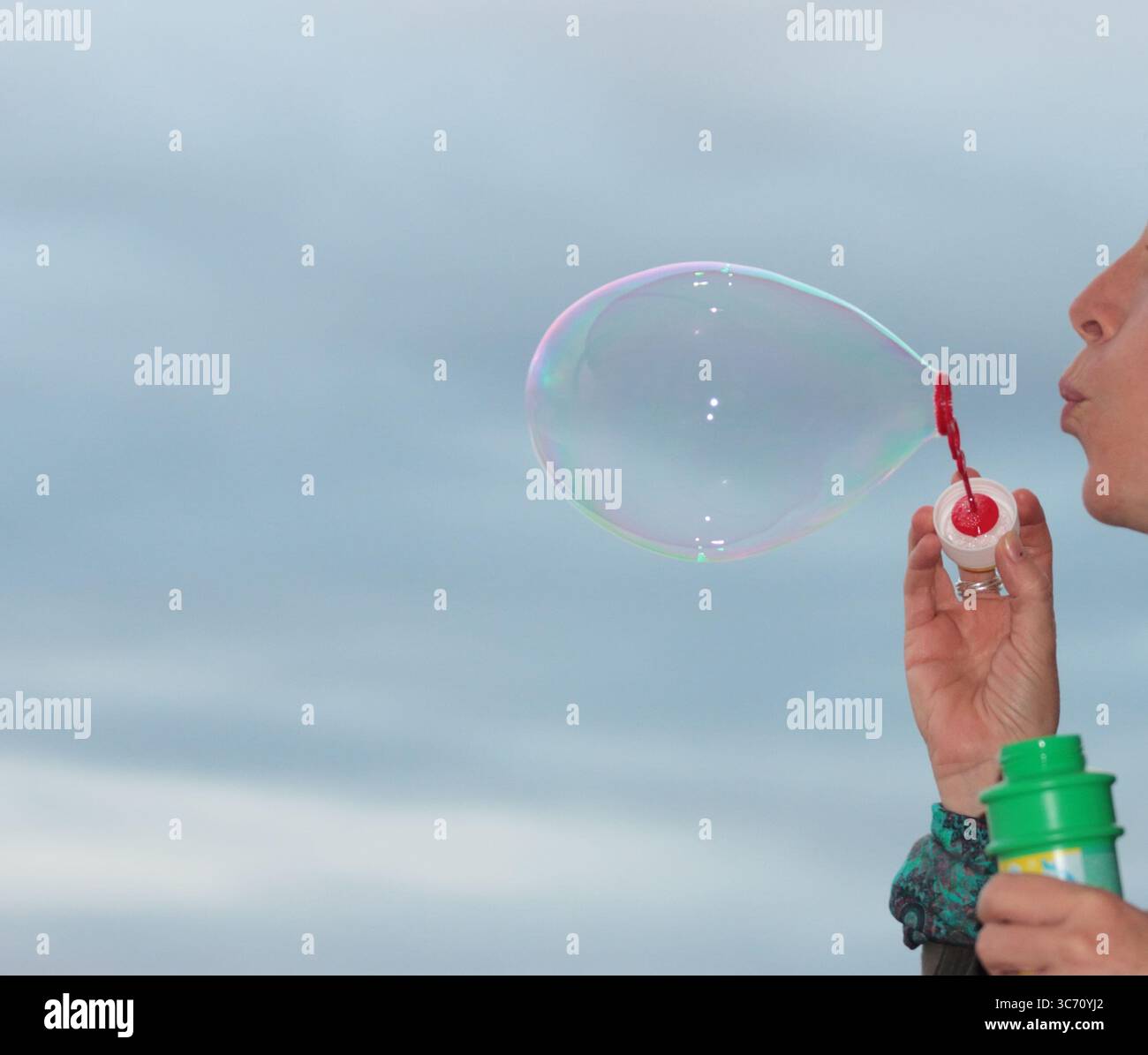 Unrecognizable Woman Blowing Soap Balloons Stock Photo - Alamy