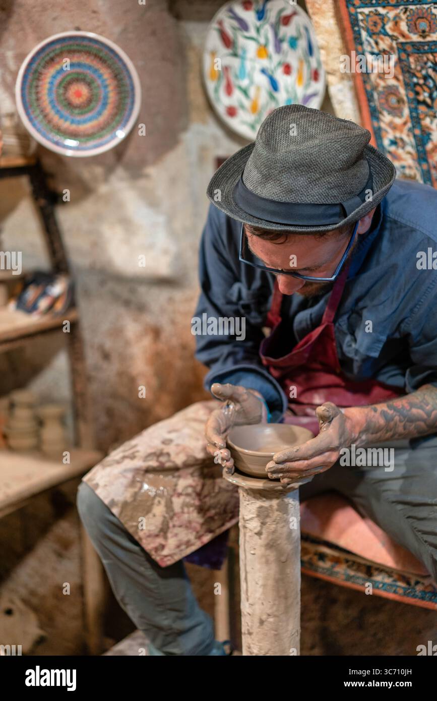 Potter apprentice using pottery wheel in Avanos Cappado Stock Photo - Alamy