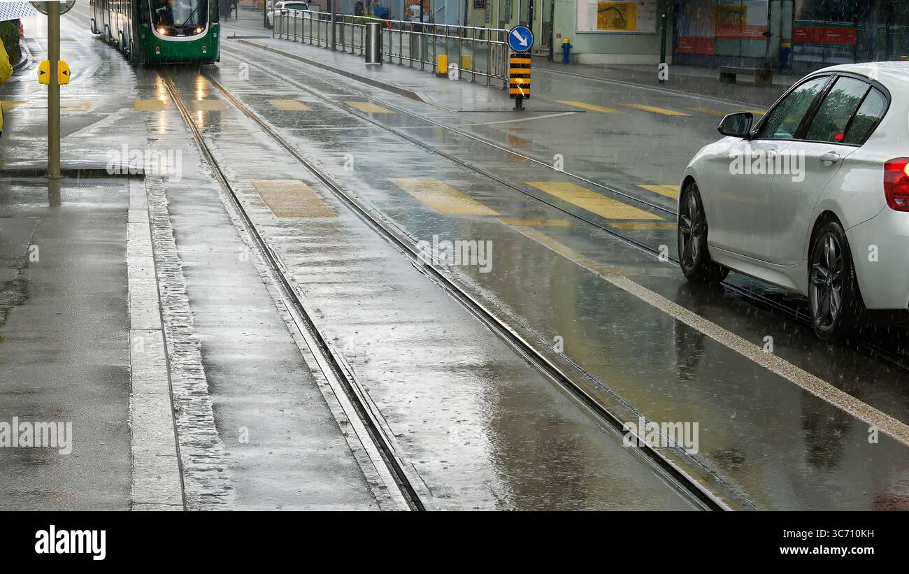 Rainy City Street With Tram Tracks, Modern Car, And Wet Pavement In ...