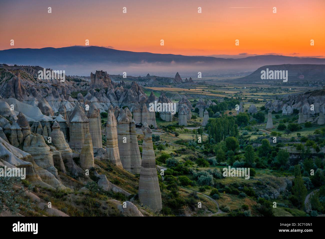 Colorful sunset illuminating Love Valley in Cappadocia, Turkey Stock ...