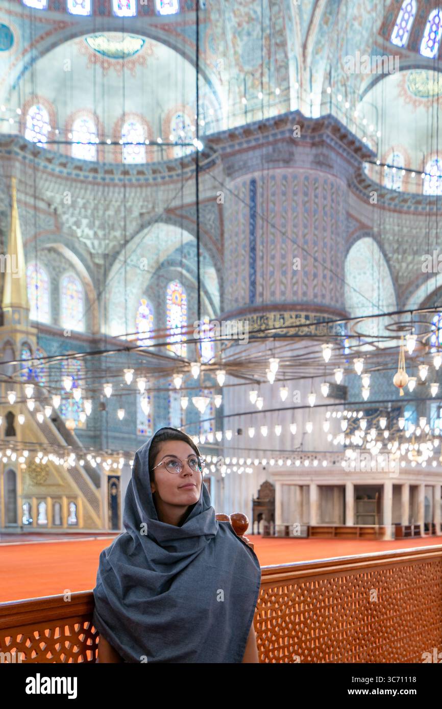 Woman tourist wearing hijab inside the Blue Mosque in Istanbul Stock ...
