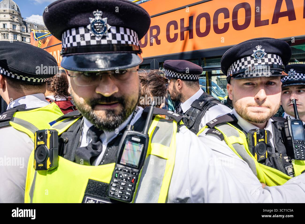 LONDON, UK - 14 June: A police officer intervenes as a confrontation ...