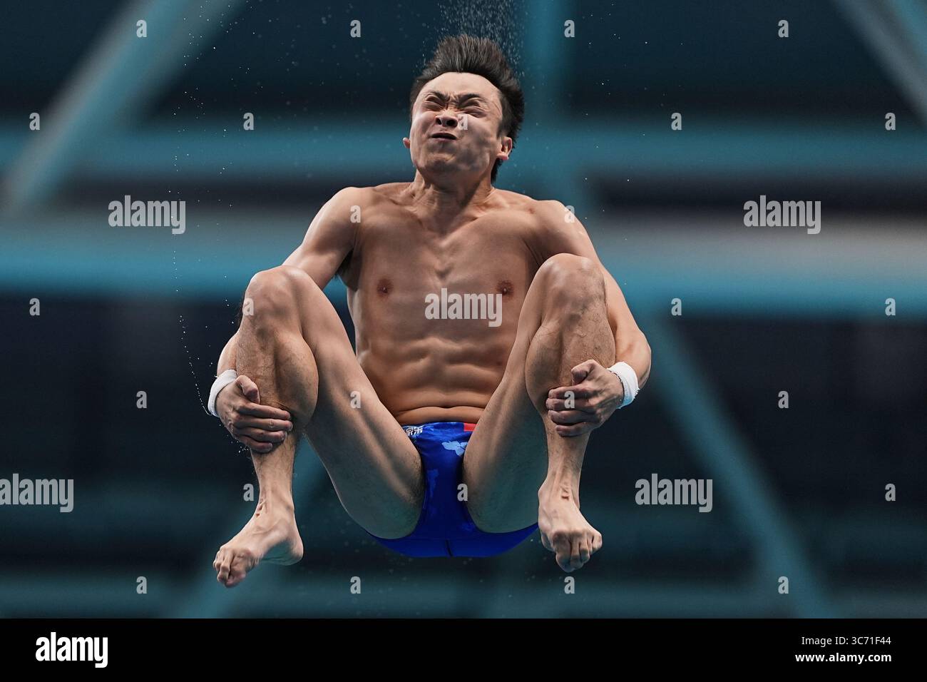 Cao Yuan of China competes in the men's 3m springboard diving final at ...