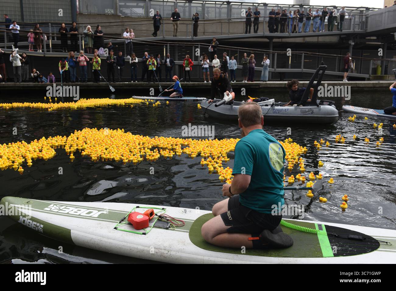 A view of the Rubber Duck Race for COSMIC Charity Hundreds of bright ...
