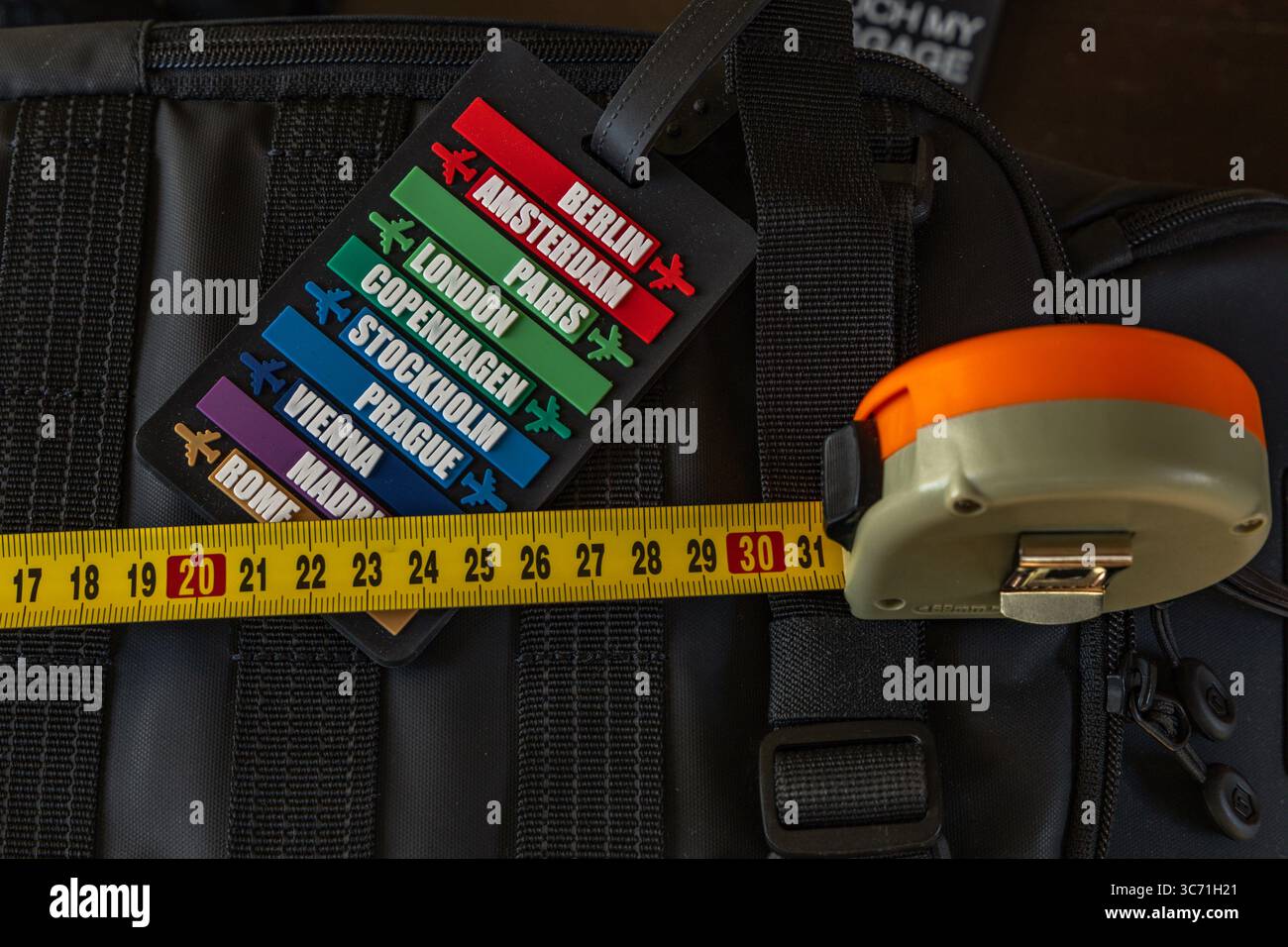 Measuring the backpack size with a tape measure before traveling by ...