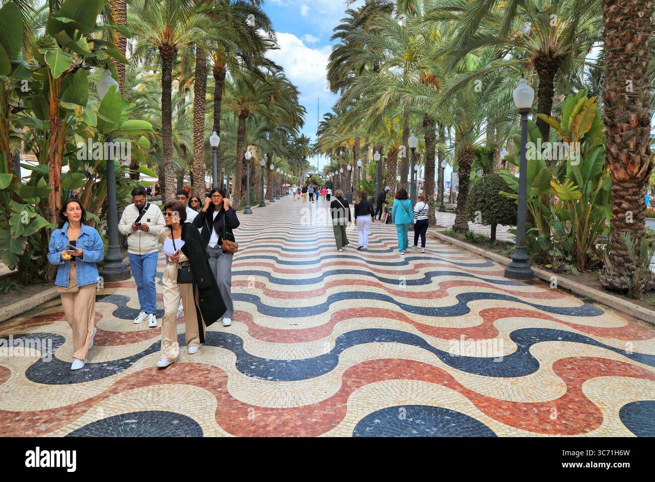 ALICANTE, SPAIN - APRIL 15, 2025: People visit Paseo de la Explanada ...